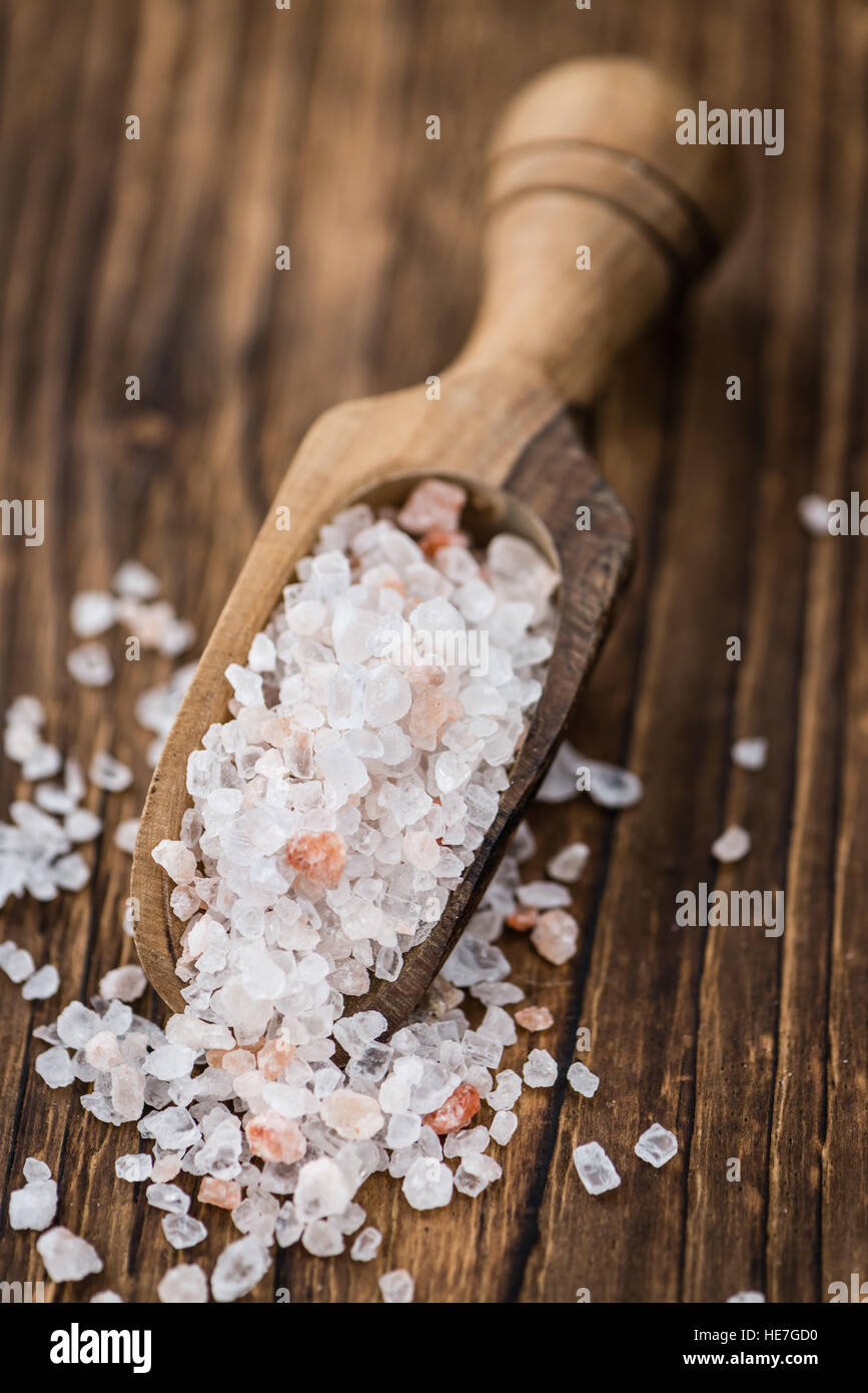 Himalayan Salt as high detailed close-up shot on a vintage wooden table ...