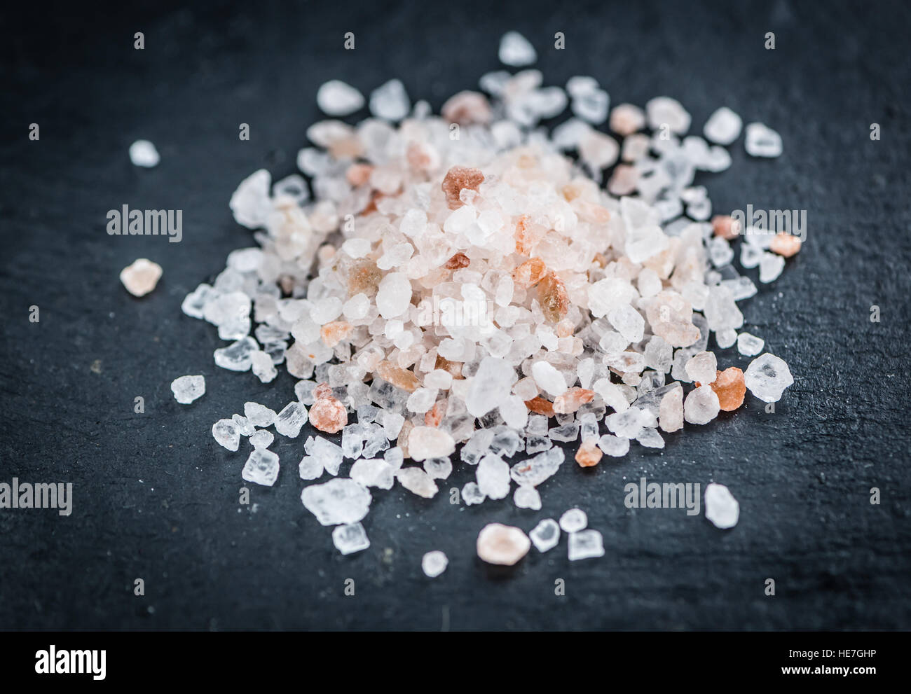 Portion of Himalayan Salt on a rustic slate slab (selective focus ...