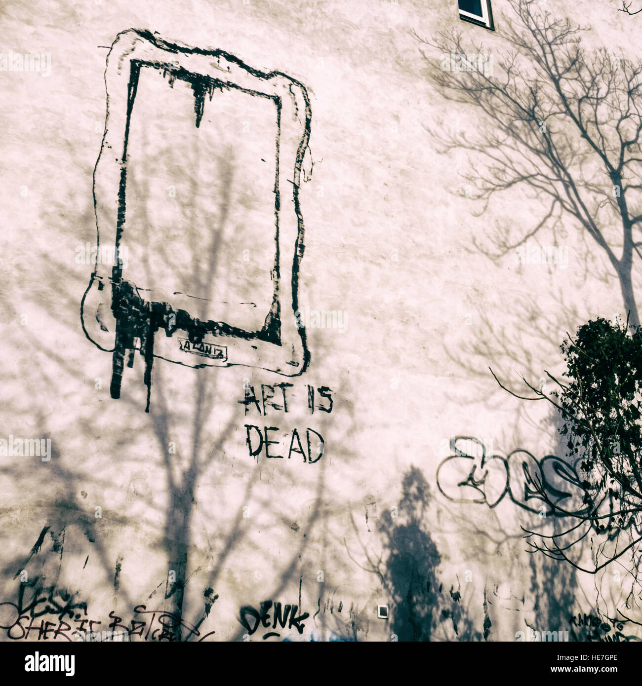 'Art is dead', Drawing of empty frame and leaking paint. Street art on ...