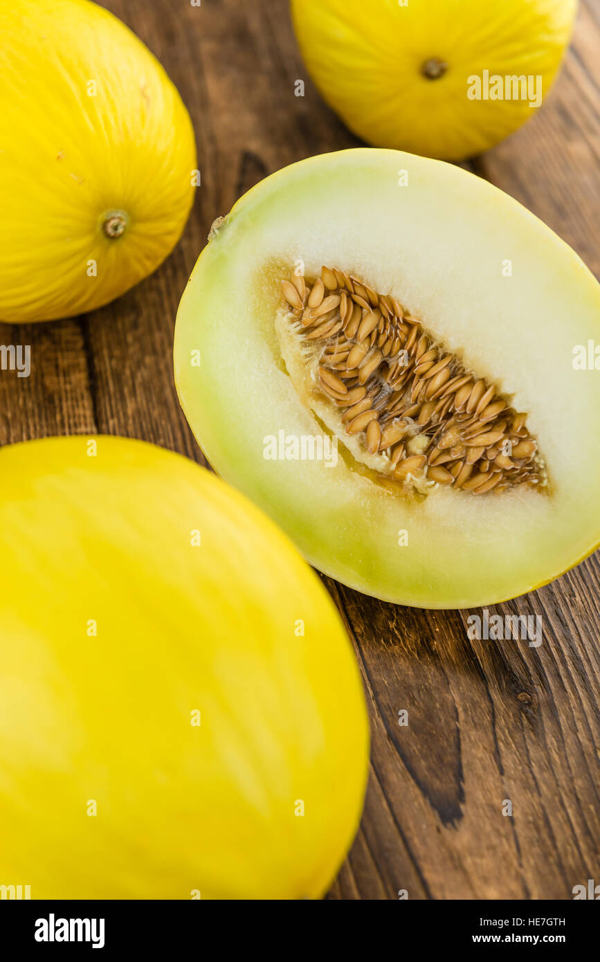 Honeydew Melon on rustic wooden background (close-up shot Stock Photo ...