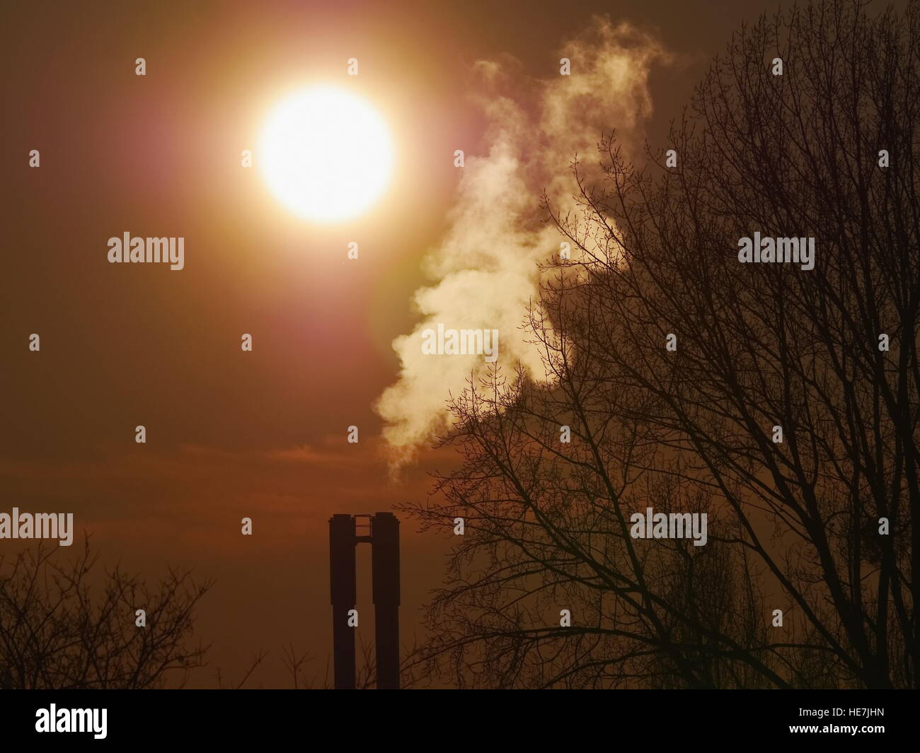 industrial chimneys sun Stock Photo - Alamy