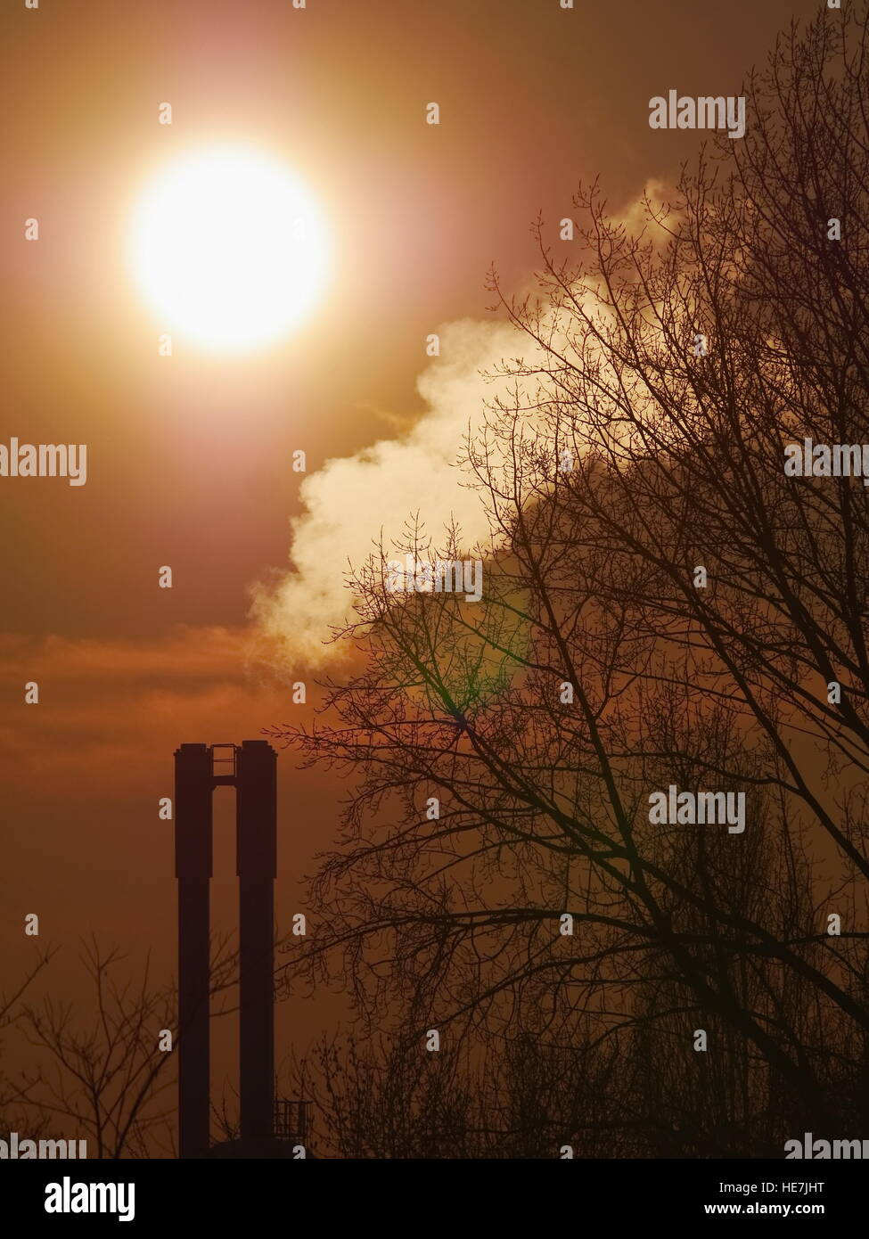 industrial chimneys sun Stock Photo - Alamy