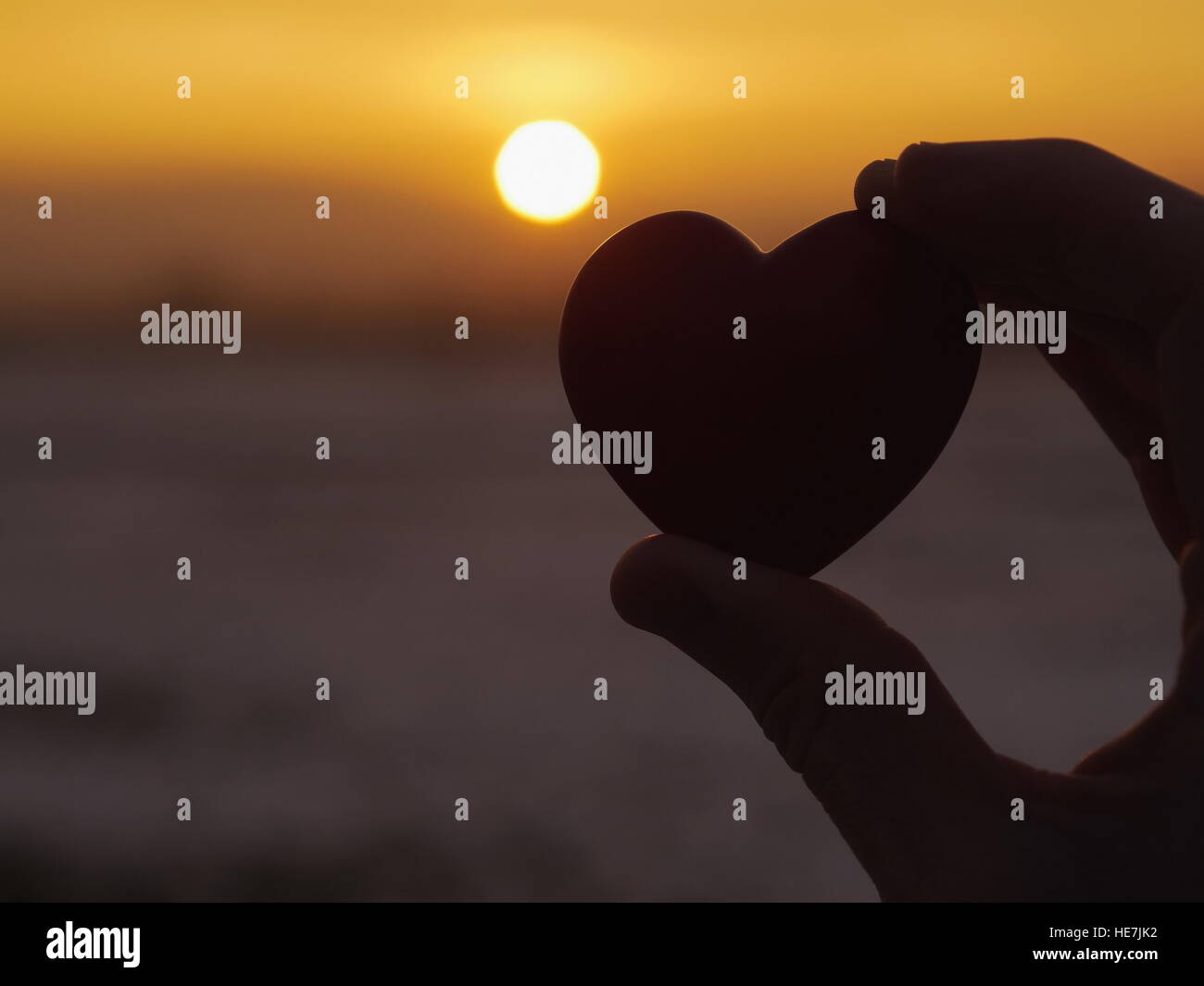 Love heart sunset hi-res stock photography and images - Alamy