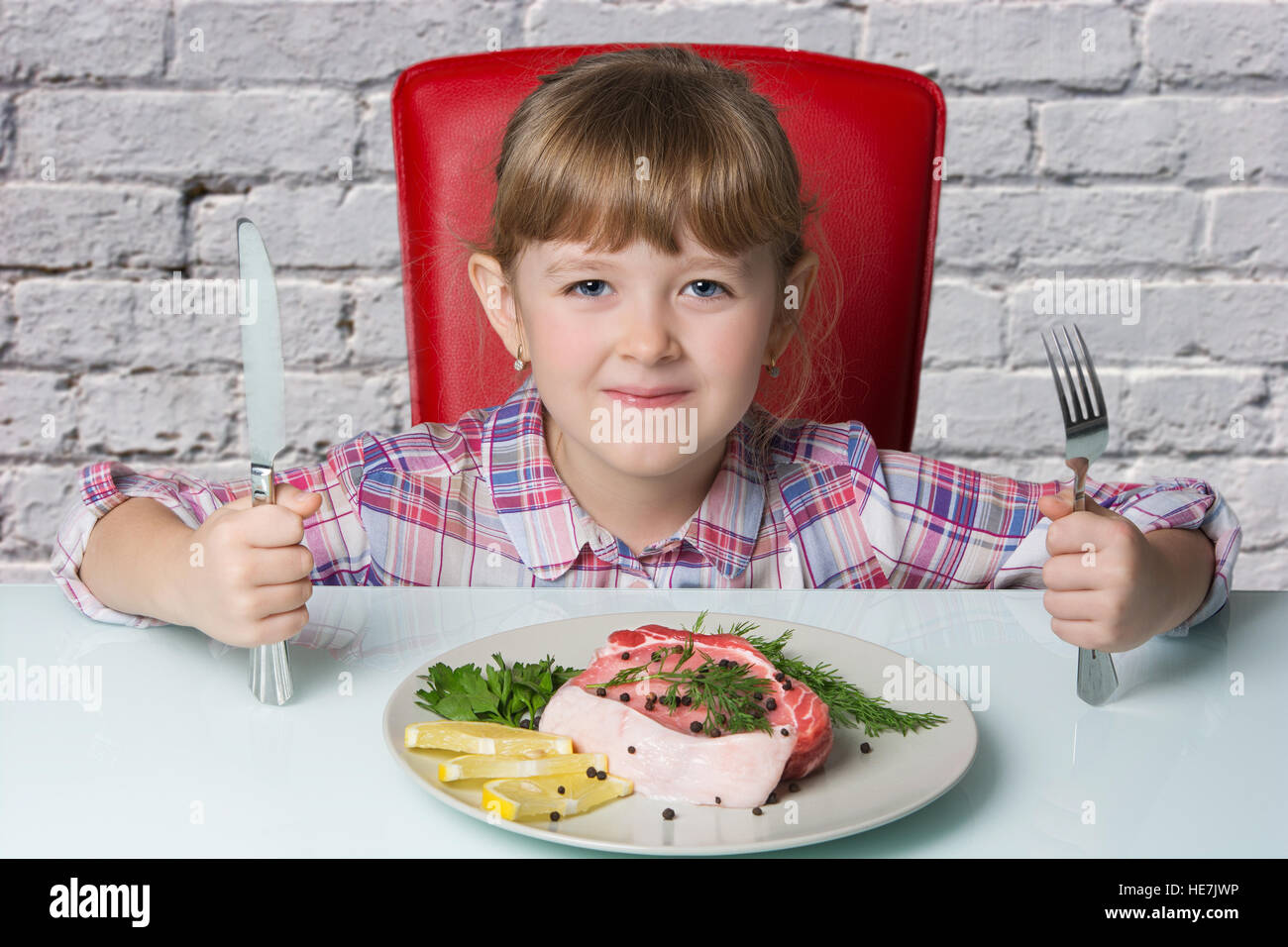child in the restaurant with a piece of fresh meat Stock Photo - Alamy