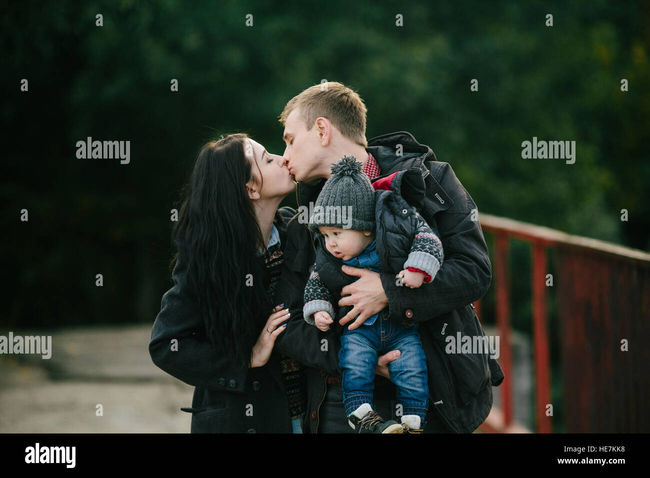 young family and son walk along the lake shore Stock Photo - Alamy