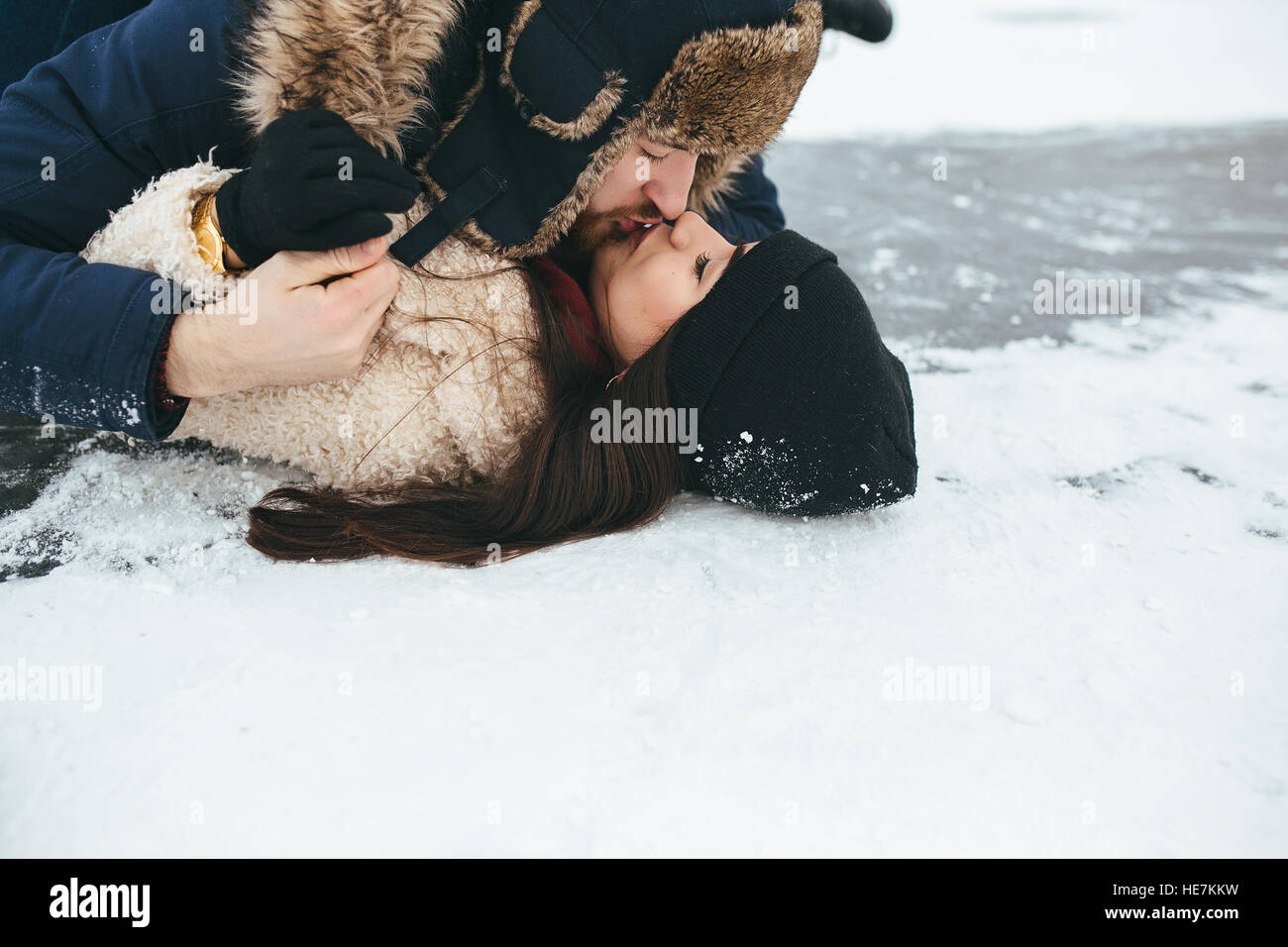 man and woman kiss on ice Stock Photo - Alamy