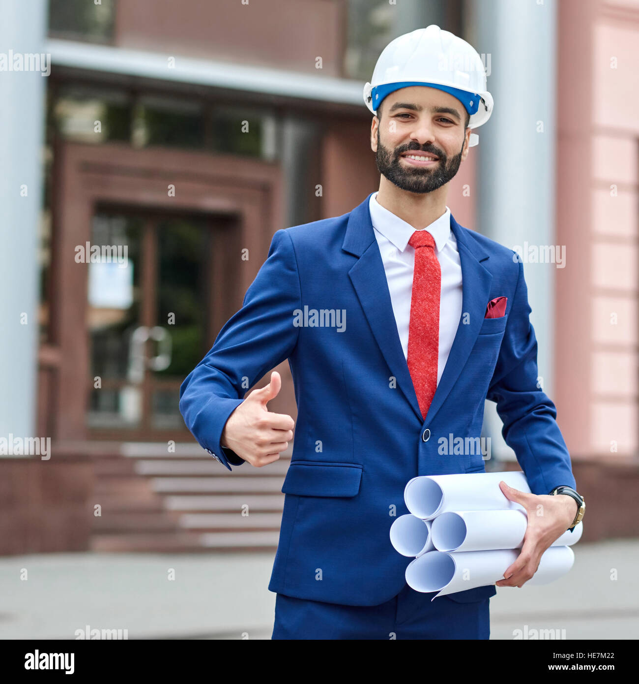 All ideas came together. Portrait of a cheerful male architect wearing ...