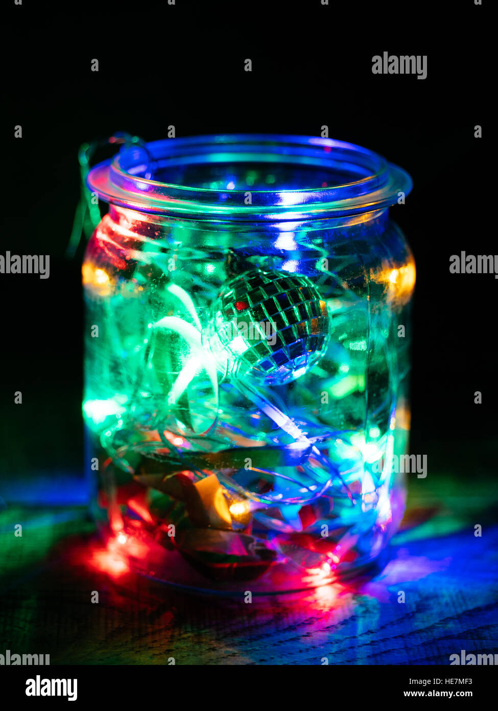 Party in a jar with disco ball and colorful led lights Stock Photo - Alamy
