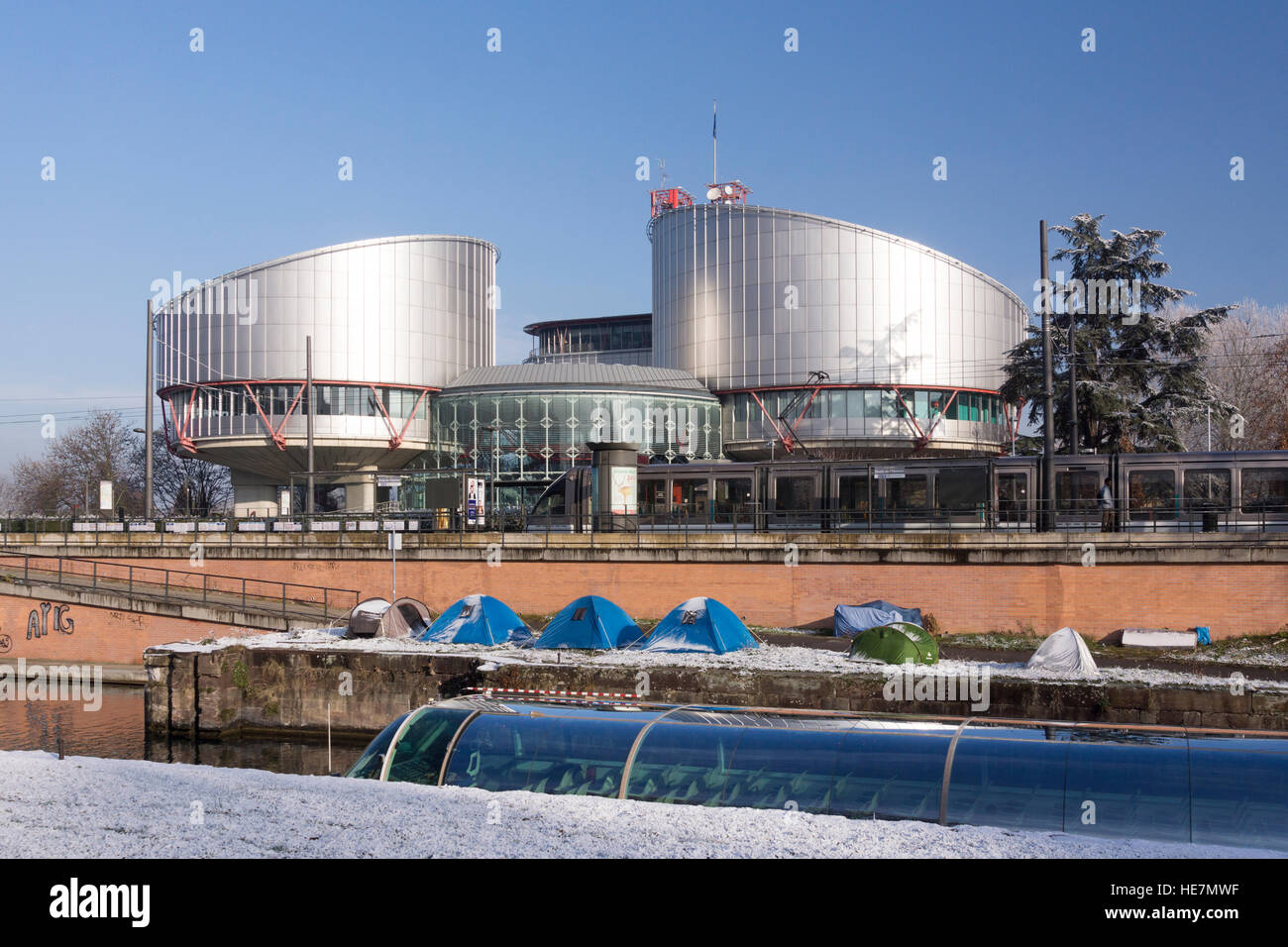 The European Court of Human Rights (ECHR), with a tourist boat passing ...