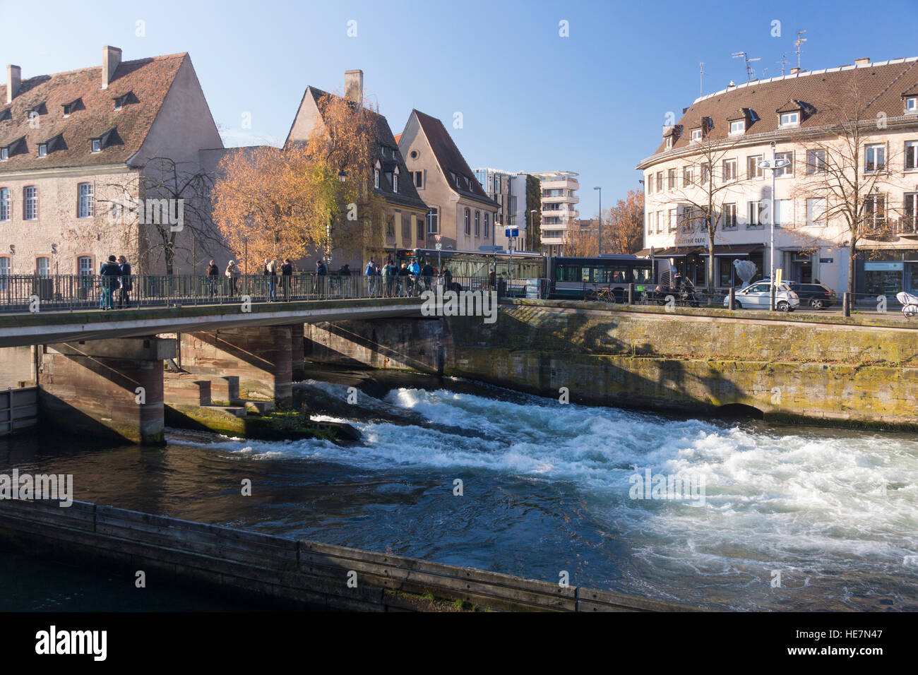 The Canal du Faux Rempart passing over a weir and locks around ...