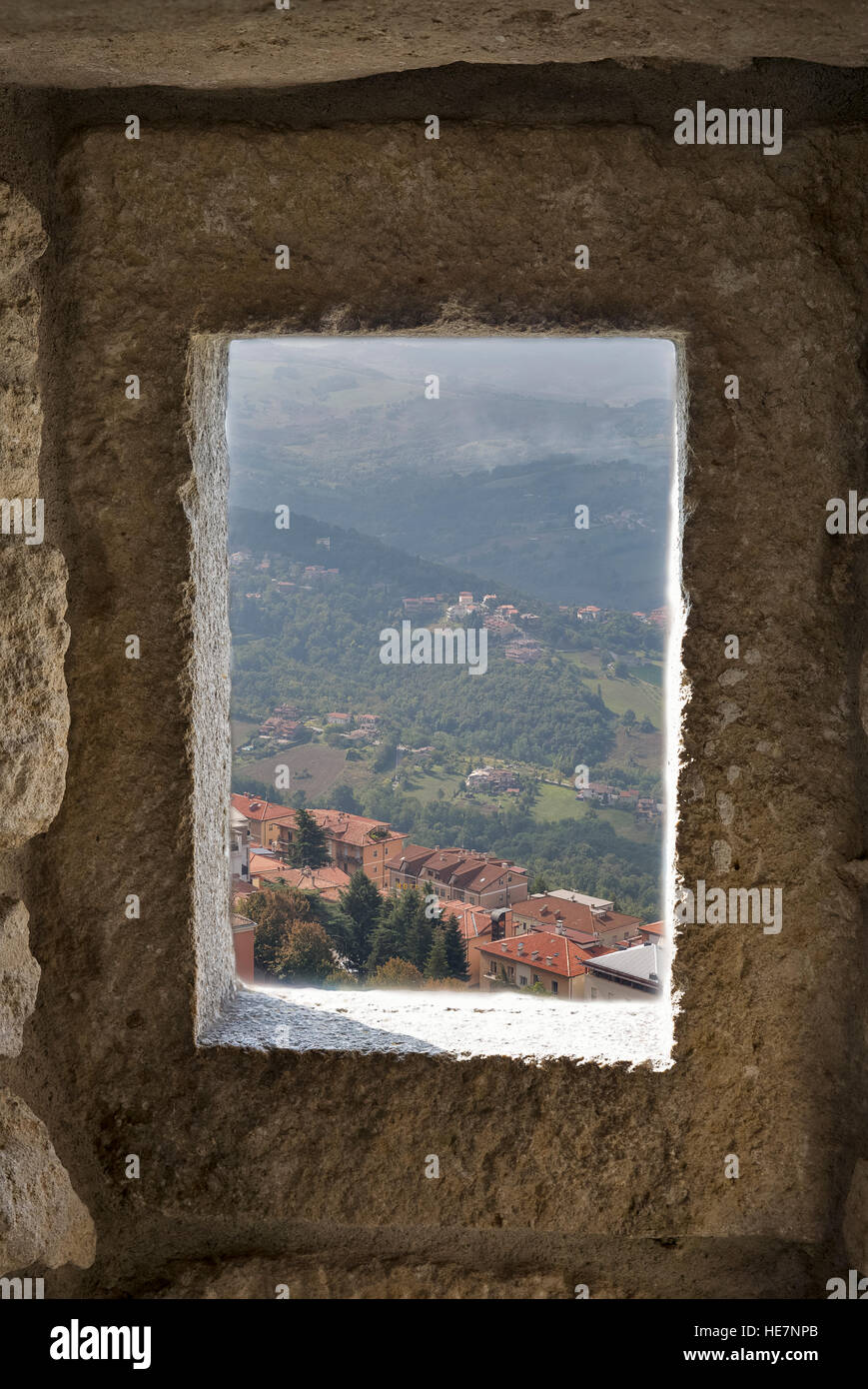Window in a medieval castle with landscape of San Marino Stock Photo ...
