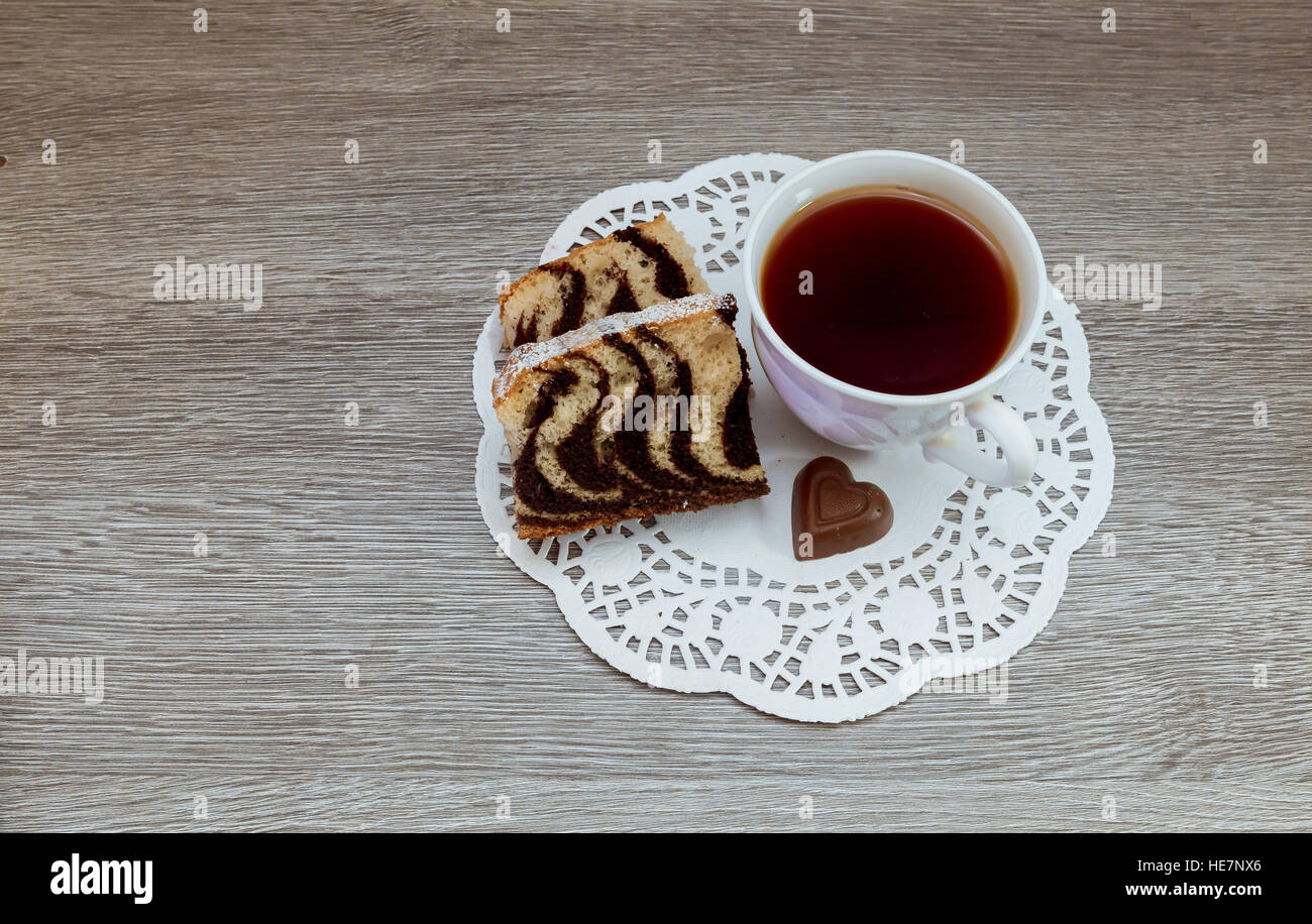 Traditional french colored Black tea with cake Stock Photo - Alamy