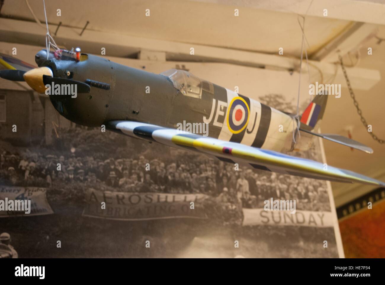 model of a spitfire hanging in a austion sale room Stock Photo - Alamy