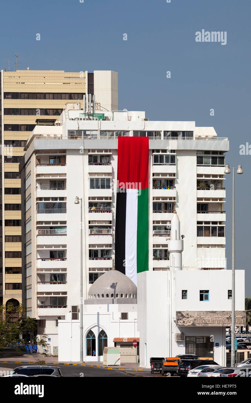 National flag of the United Arab Emirates on a building in the city of ...