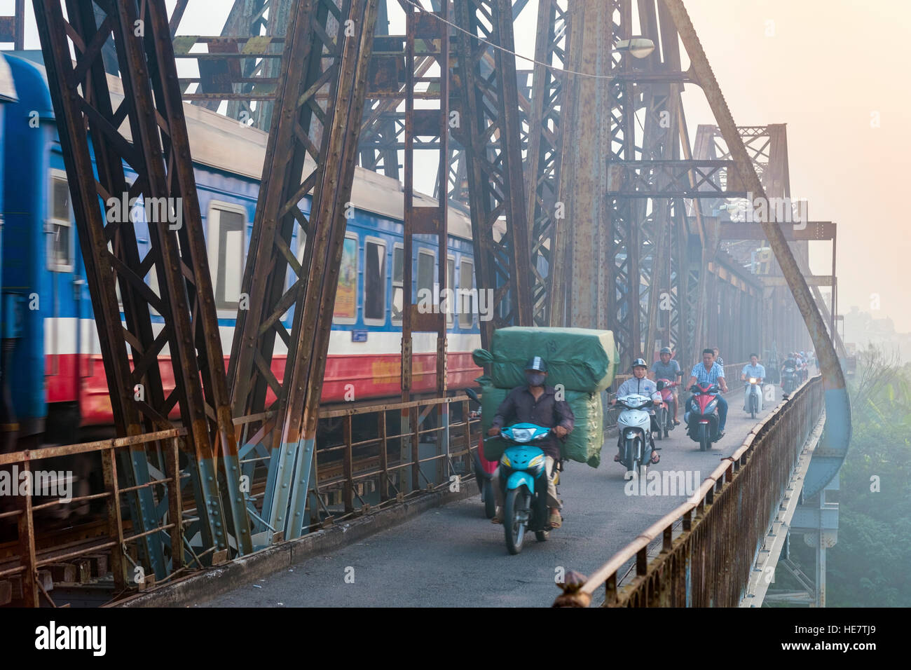 Hanoi - rail and passenger bridge over the Red River, motorbike ...