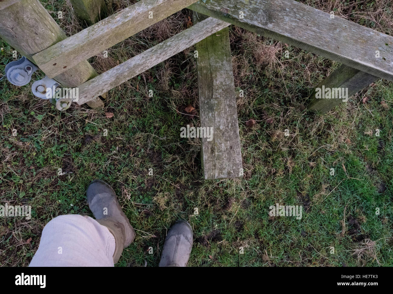 Walker seen standing next to a timber built gated entrance by way of a ...