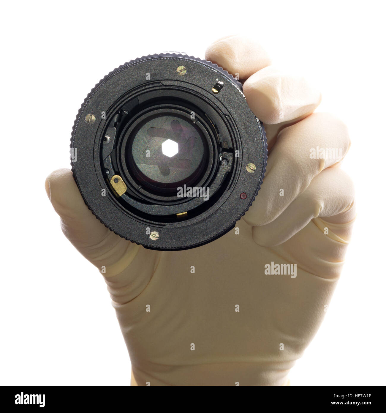 Lens camera in his hand, a hand in a white glove on a white background ...