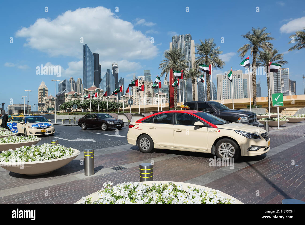 DUBAI, UNITED ARAB EMIRATES - DECEMBER 10, 2016: Dubai street with palm ...