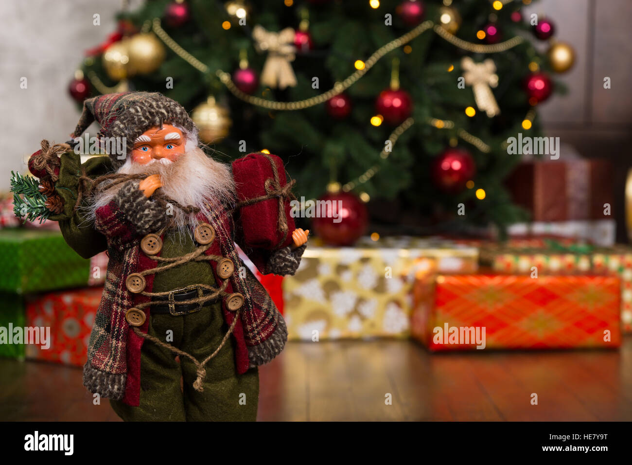 Santa Claus doll with a blush on the cheeks wearing traditional costume ...