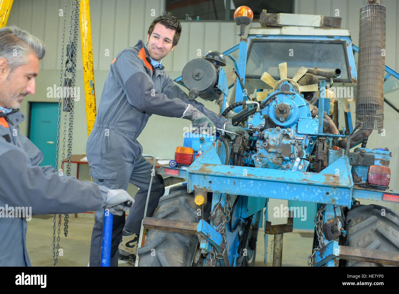 fixing a tractor Stock Photo - Alamy