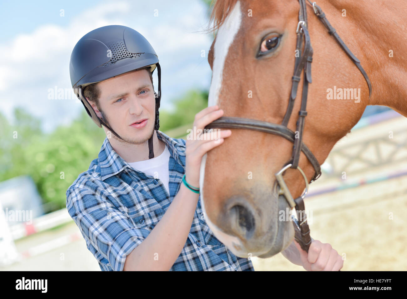 Young man with horse Stock Photo - Alamy