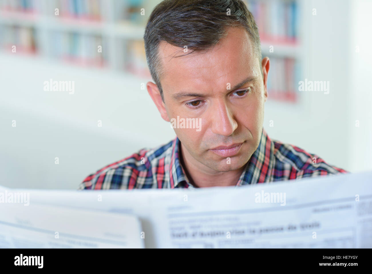reading a news Stock Photo - Alamy