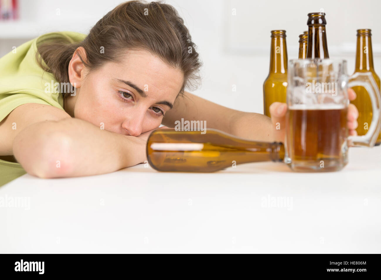 Woman slumped on table hi-res stock photography and images - Alamy