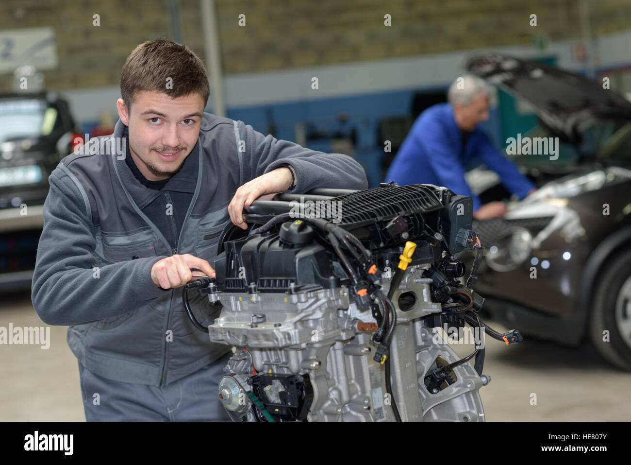 auto mechanic shows trainee maintenance of car engine Stock Photo - Alamy