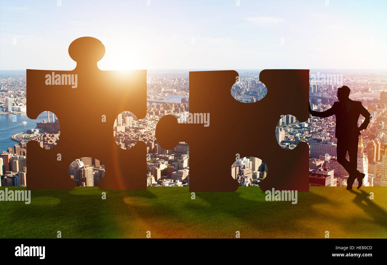 Business concept of teamwork with jigsaw puzzle Stock Photo - Alamy