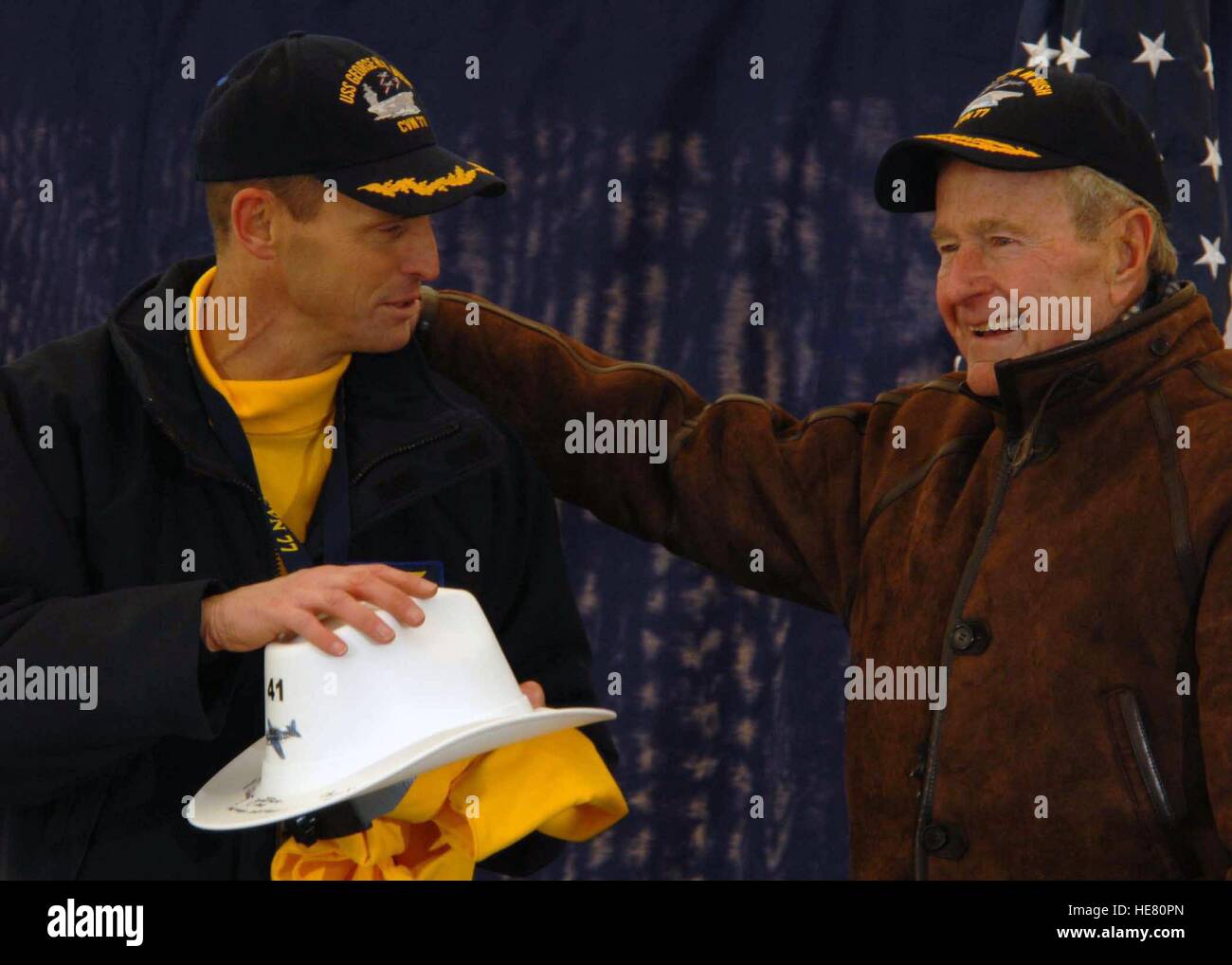 U.S. Navy Commanding Officer Kevin O'Flaherty presents former U.S ...
