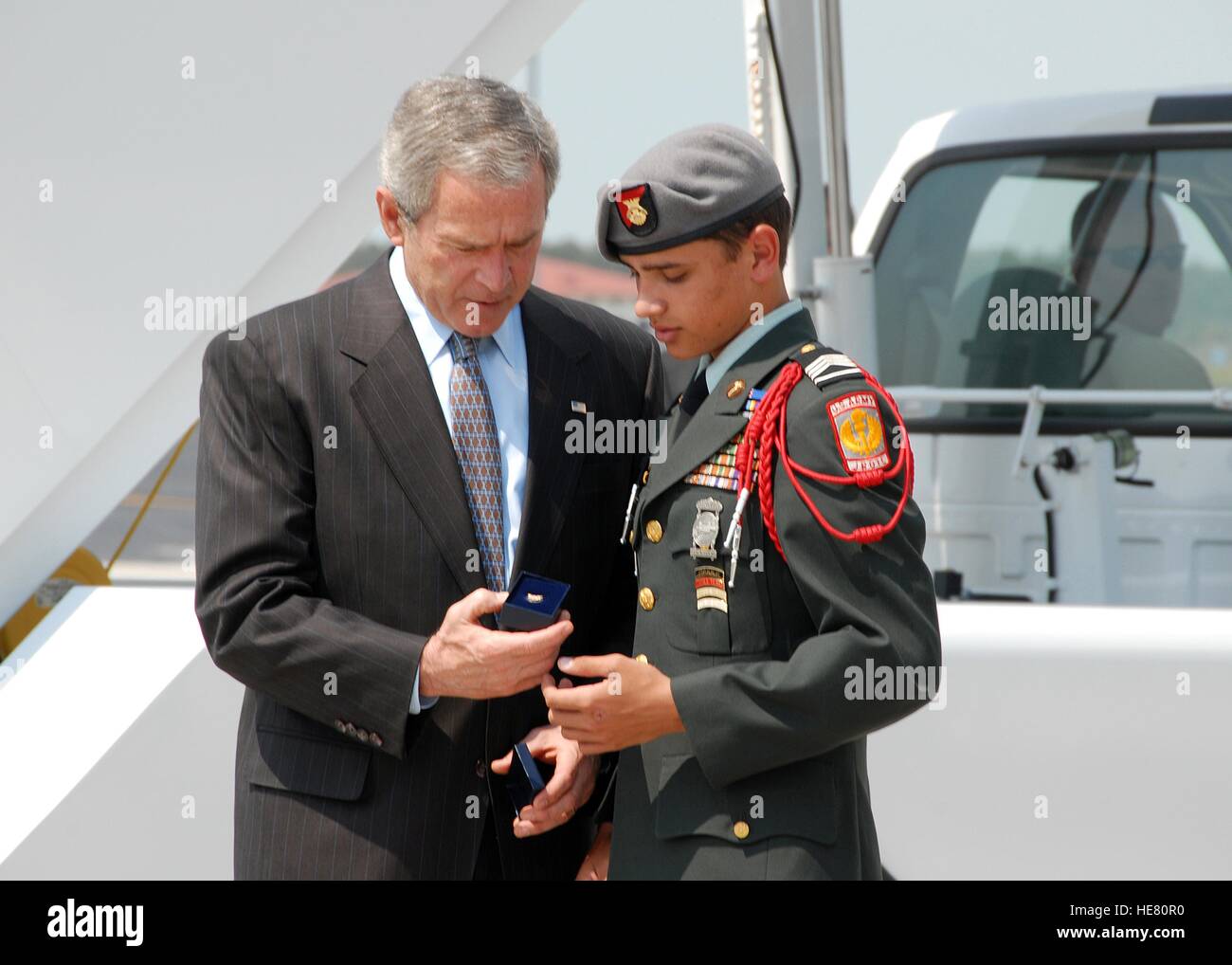 U.S. President George W. Bush presents 16-year-old junior ROTC student ...