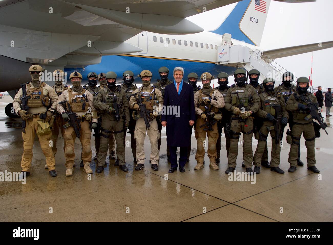 U.S. Secretary of State John Kerry poses with masked German Federal ...