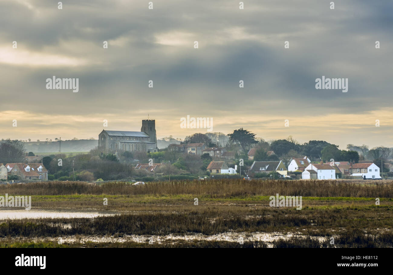 Coastal view of Salthouse church and surrounding dwellings Stock Photo ...