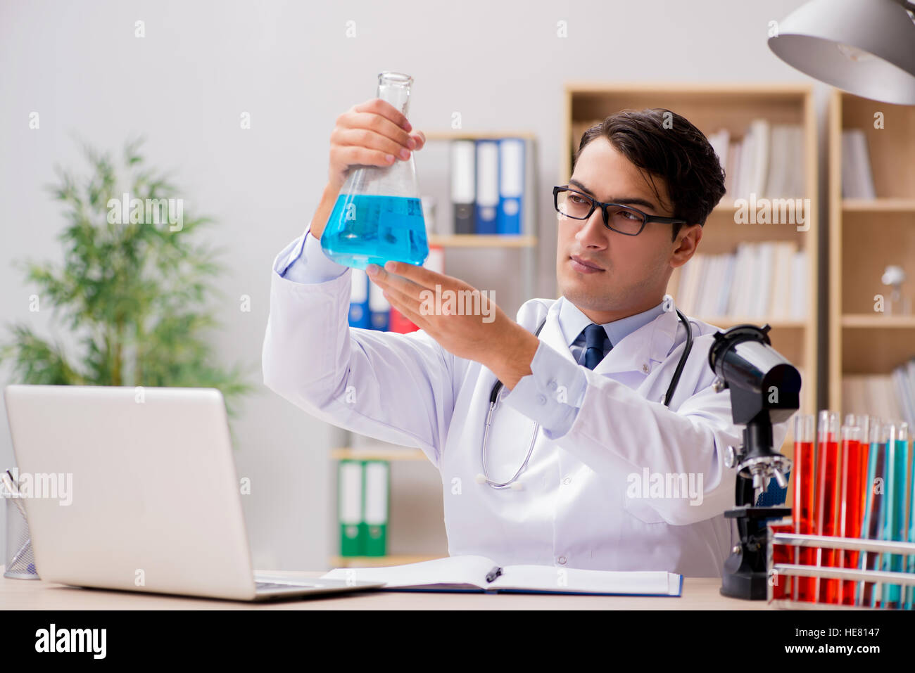 Man doctor working in the lab Stock Photo - Alamy