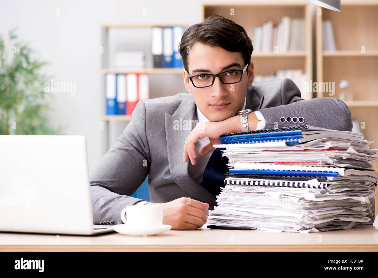 Handsome businessman working in the office Stock Photo - Alamy