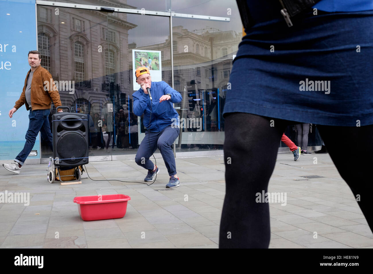 A young street entertainer doing human beatbox on the streets of London ...