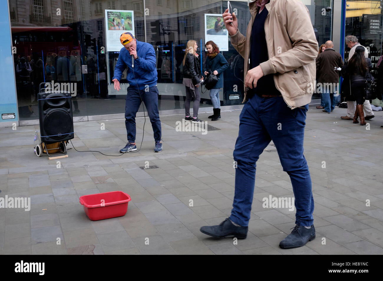 A young street entertainer doing human beatbox on the streets of London ...