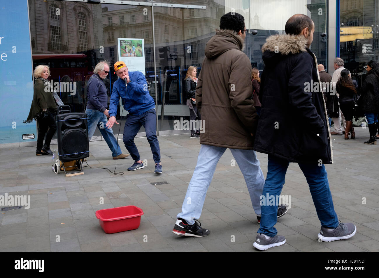 A young street entertainer doing human beatbox on the streets of London ...