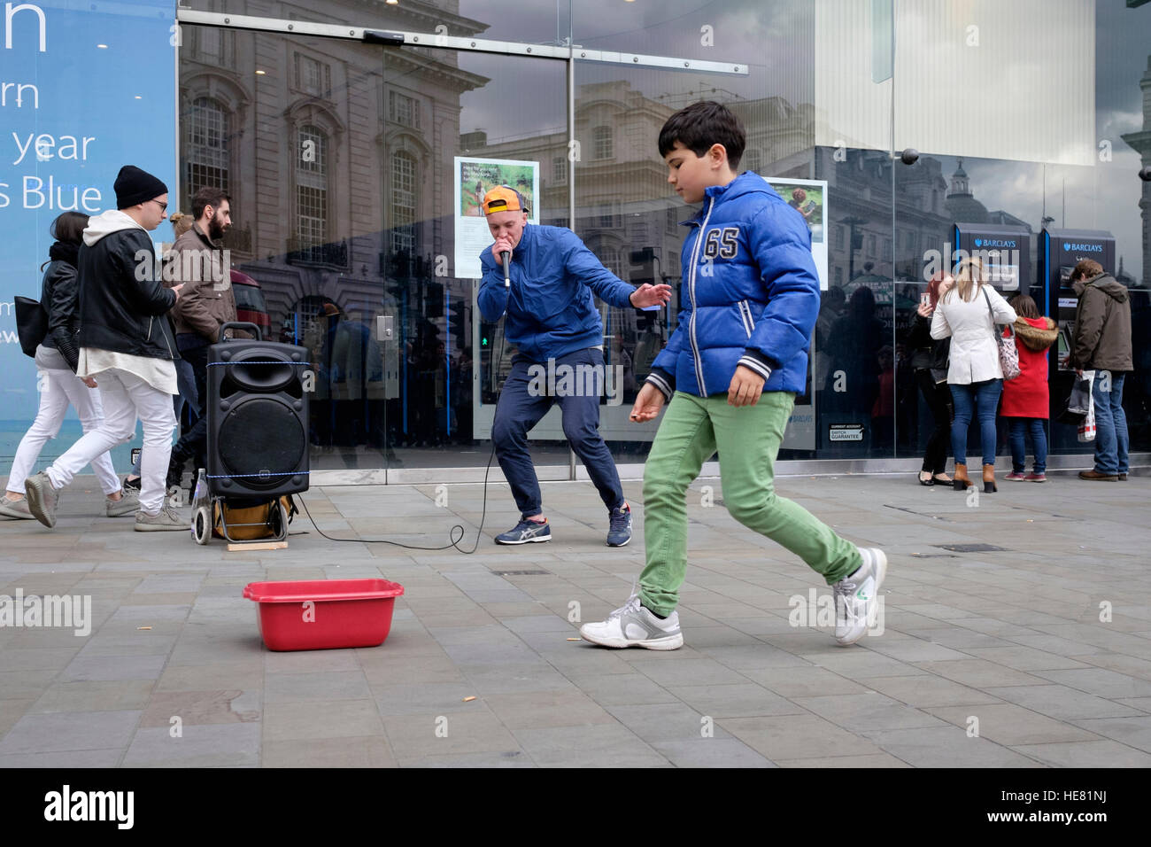 A young street entertainer doing human beatbox on the streets of London ...