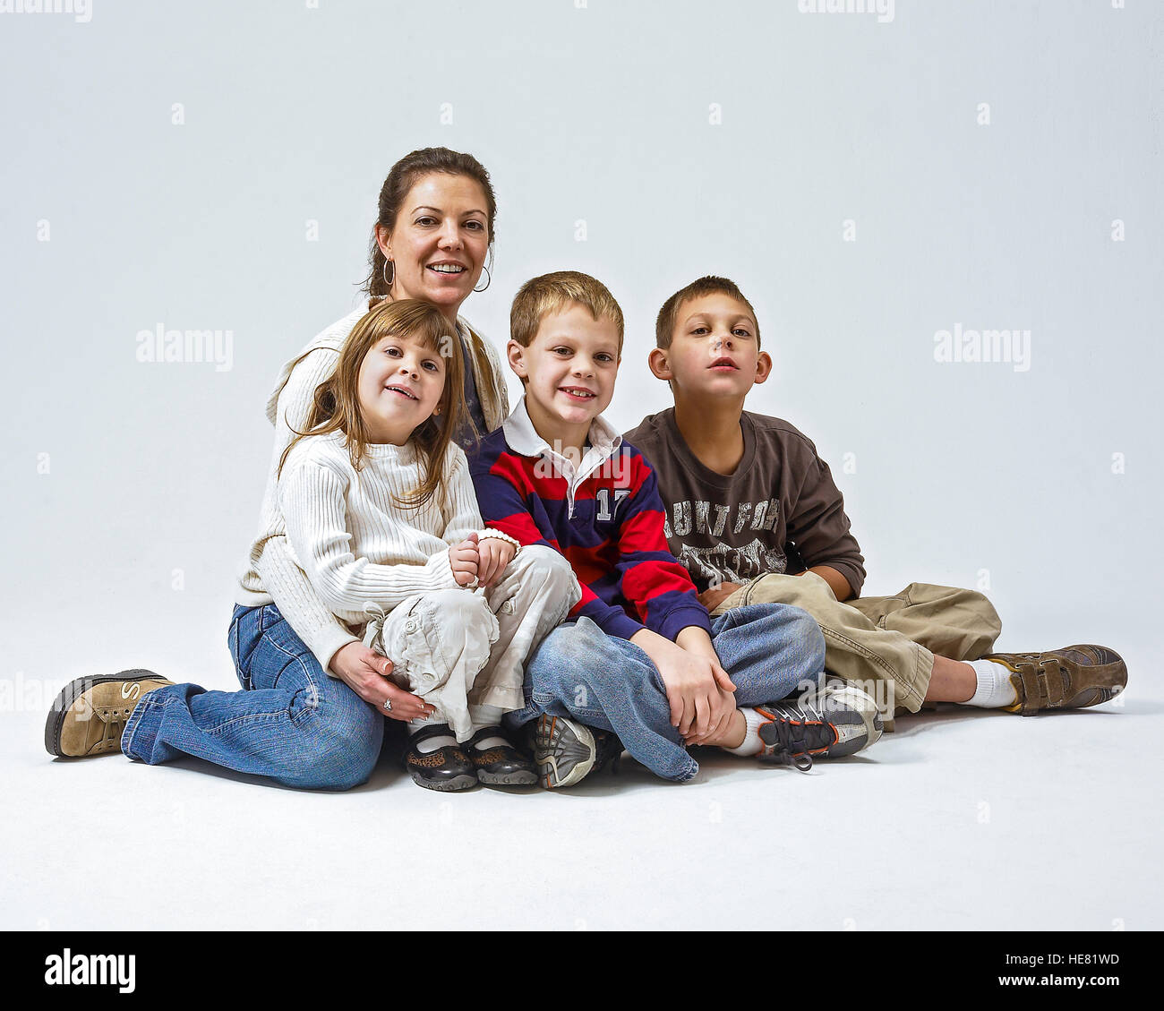 Mother with three children Stock Photo - Alamy