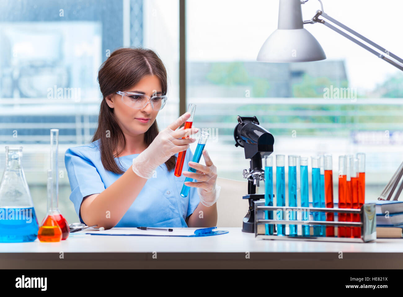 Young woman working in the laboratory Stock Photo - Alamy