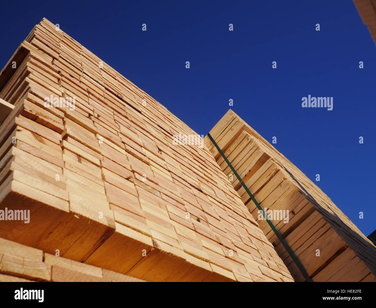 Stacks of planks against the deep blue sky Stock Photo - Alamy