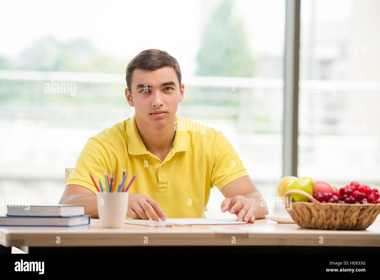 Young man drawing pictures in studio Stock Photo - Alamy