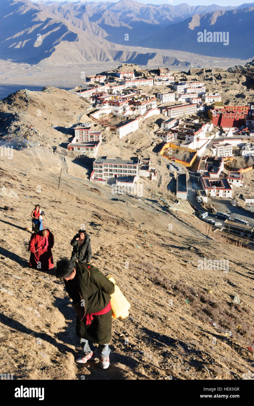 Ganden: Monastery Ganden; Monk and Tibetan ascending to the high Kora ...