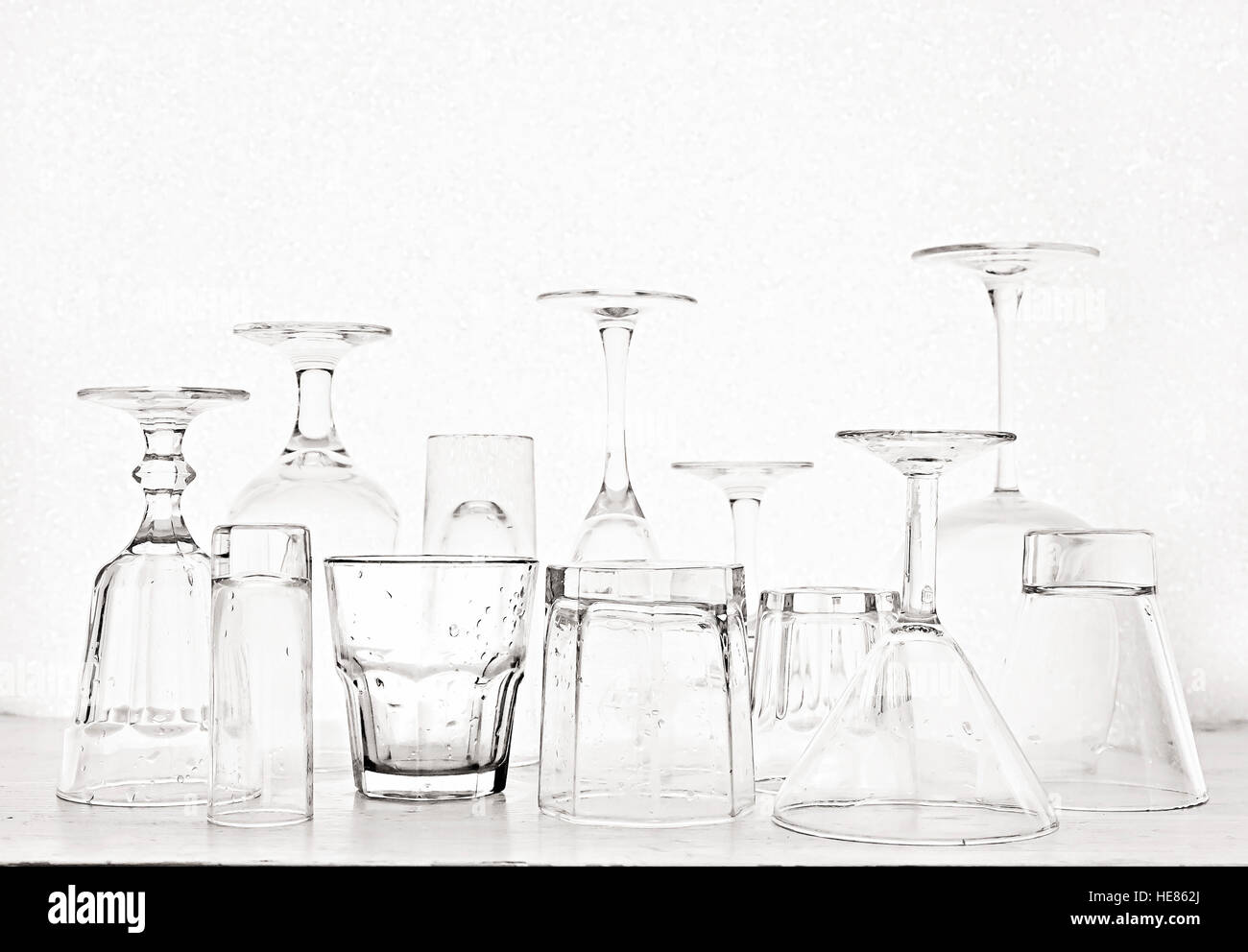 Glass goblets of different shapes on a white background Stock Photo - Alamy
