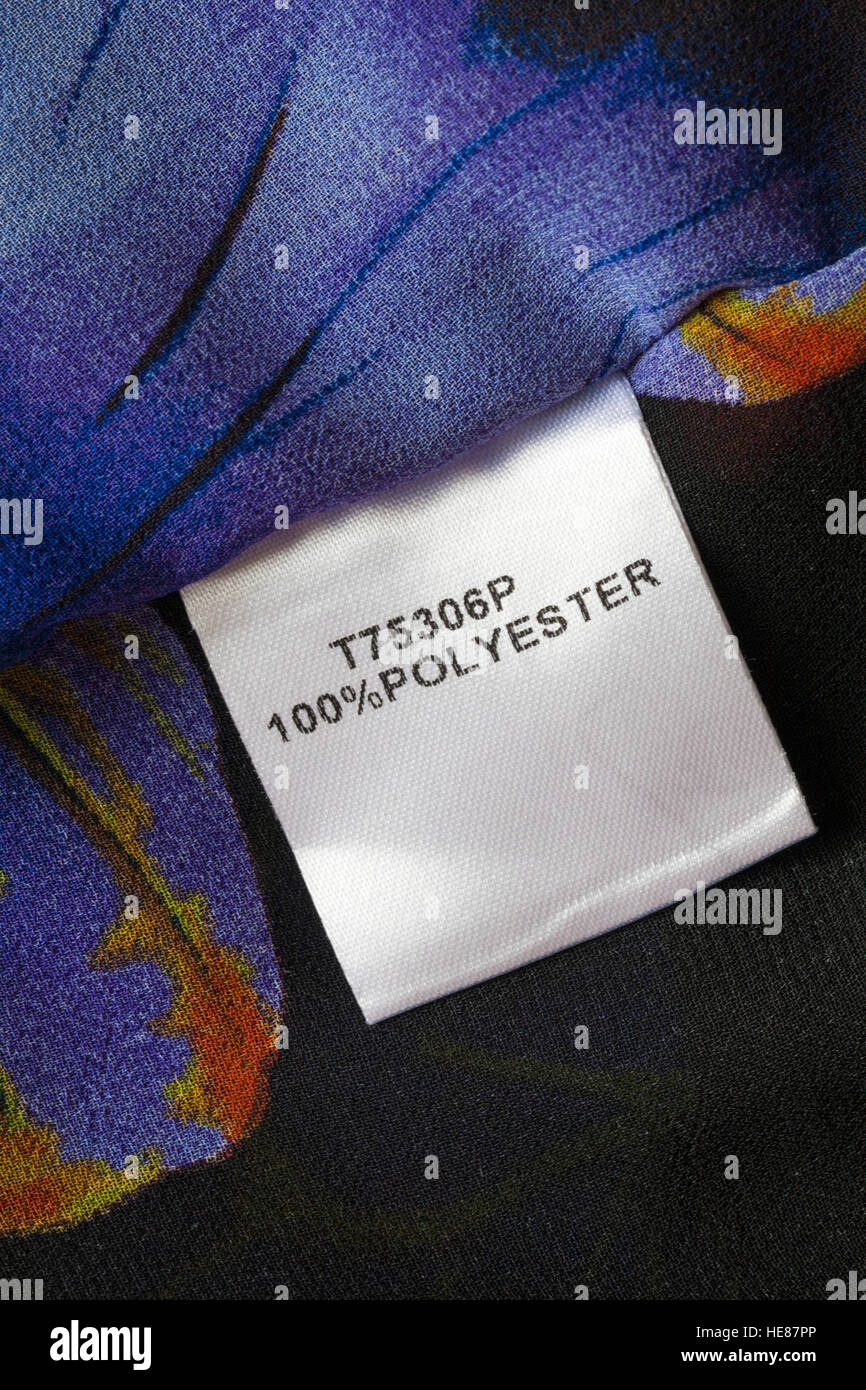 100% polyester label in woman's garment Stock Photo - Alamy