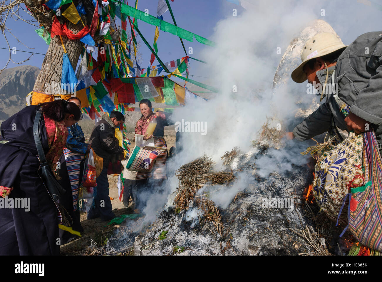 Tibetans burn juniper as a sacrifice to the hi-res stock photography ...