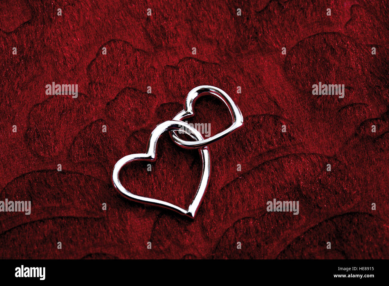 Two hearts entwined Stock Photo - Alamy