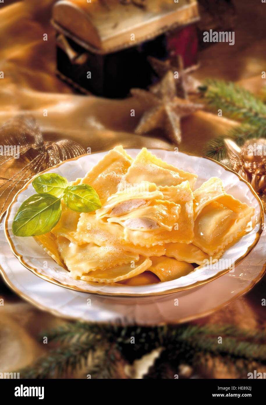 Ravioli with melted butter, table with christmas decorations Stock ...