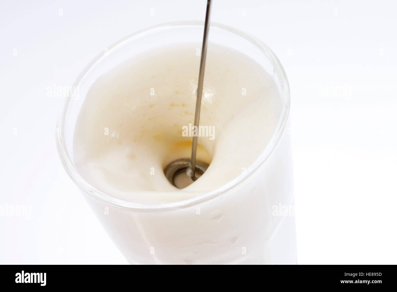 Milk being frothed up Stock Photo - Alamy